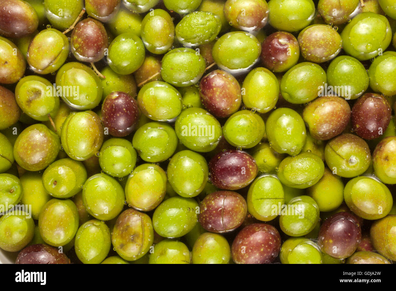 Fresh green olives sold at a market Stock Photo - Alamy