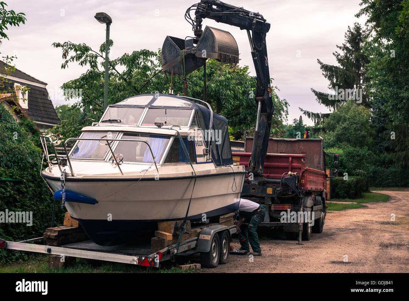 semi boat loading for transport on transporter van truck, retro vintage ...