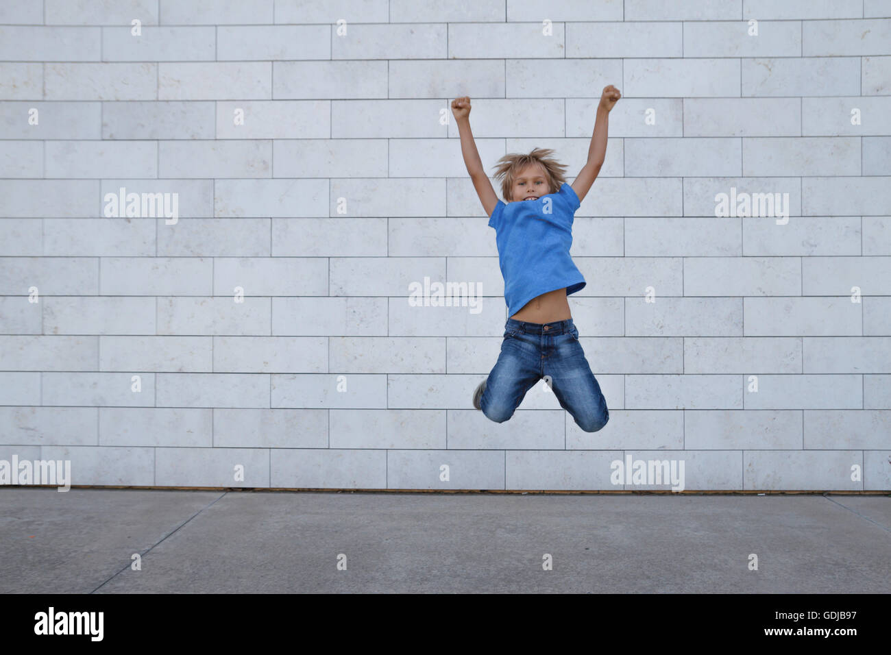 Happy little boy jumps high. People, childhood, happiness, freedom ...