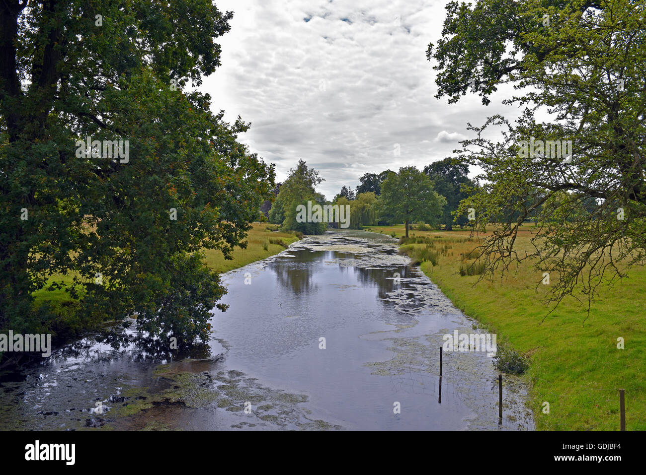 A beautiful man made lake looks like a river in the Norfolk countryside ...