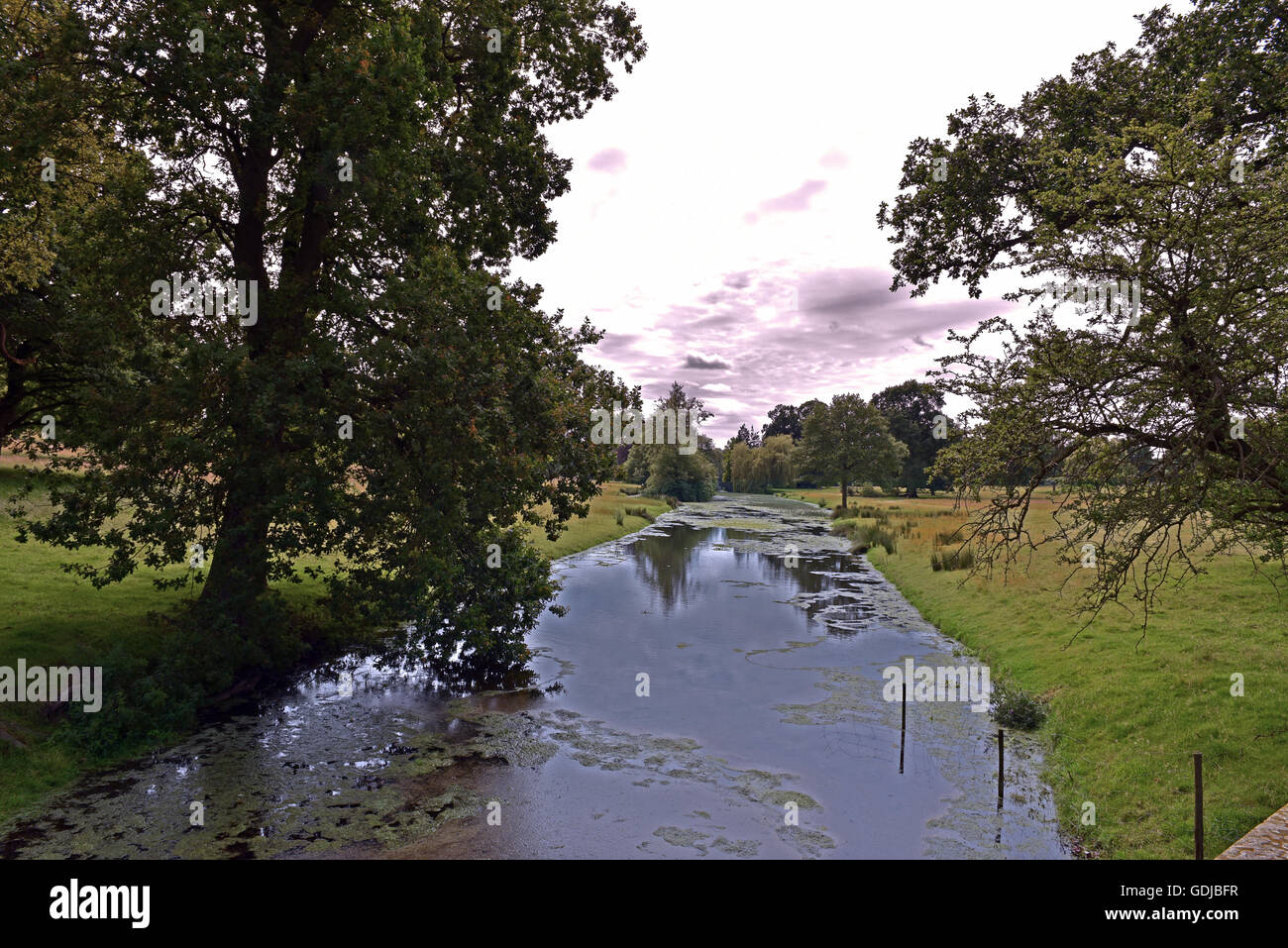 A beautiful man made lake looks like a river in the Norfolk countryside ...