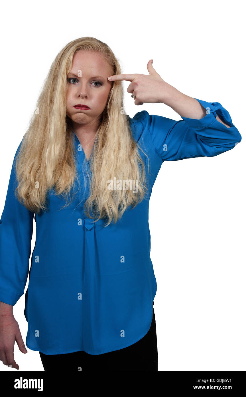 Beautiful woman making a finger gun to the head after making a mistake ...