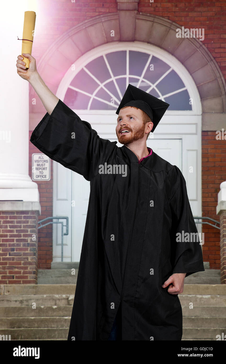 Young man in his graduation robes Stock Photo - Alamy