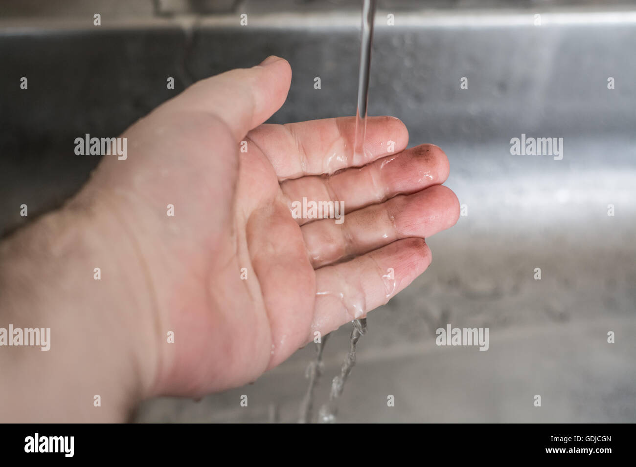 Washing hand with water from the faucet Stock Photo - Alamy