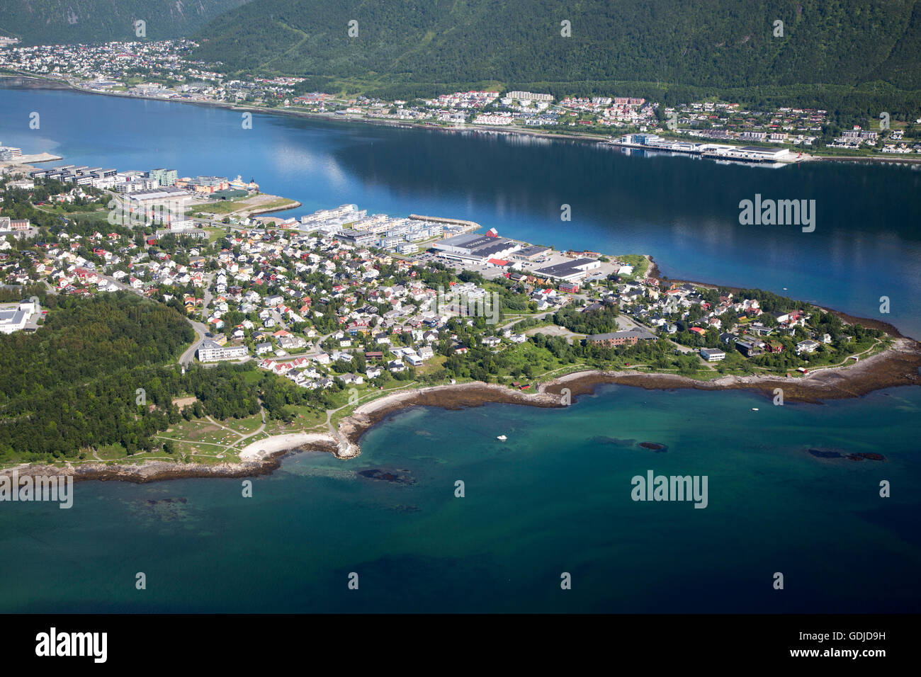 Aerial view of Tromso city showing harbour and suburban housing, Norway ...
