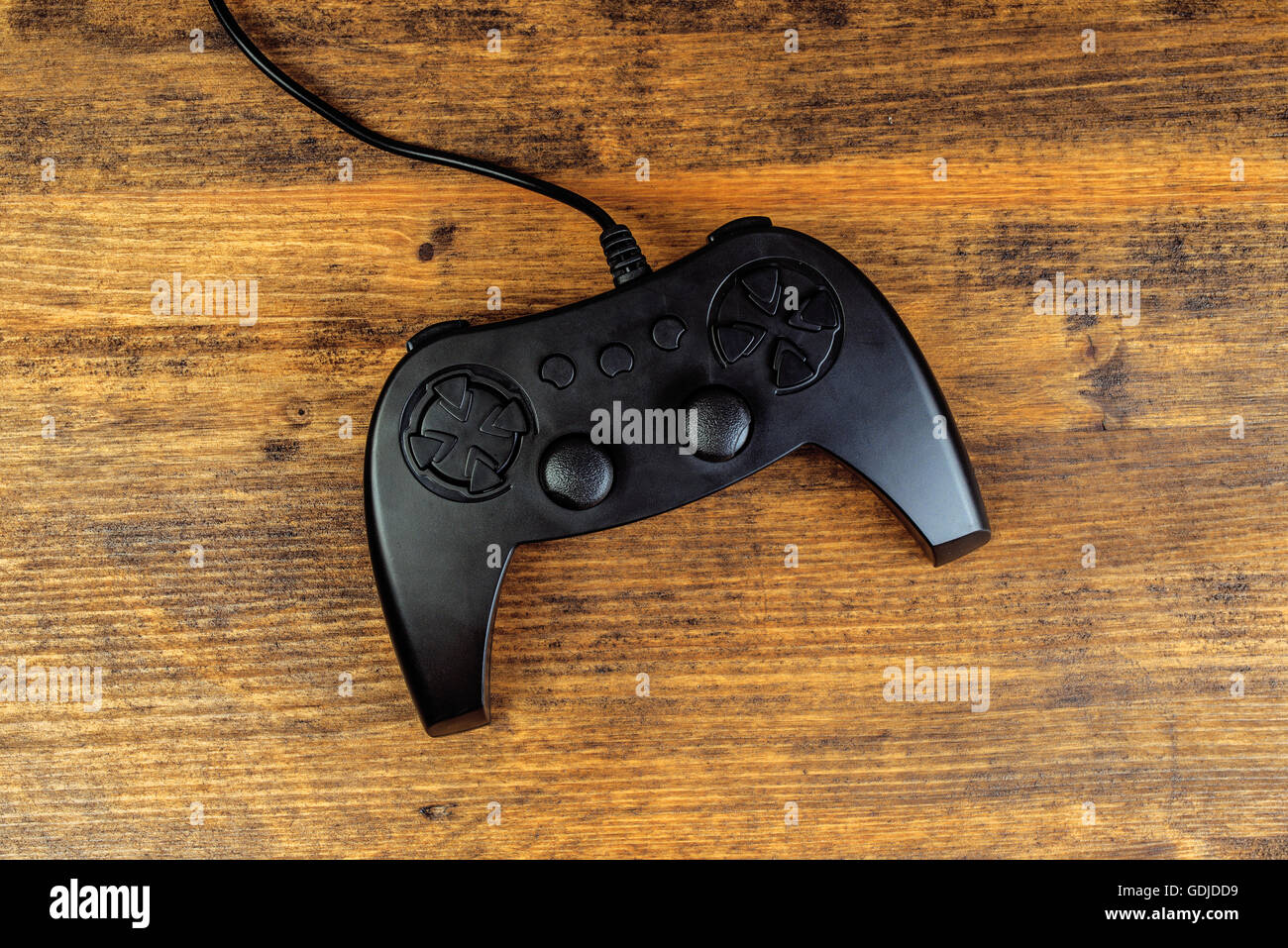 Game pad controller on wooden desk, flat lay top view, gaming and ...