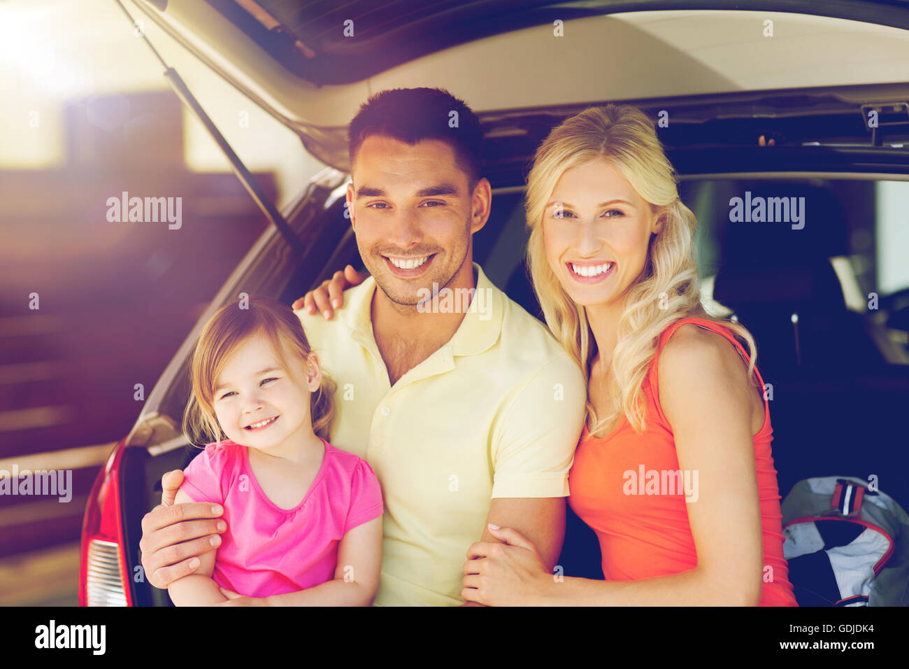 happy family with hatchback car at home parking Stock Photo - Alamy