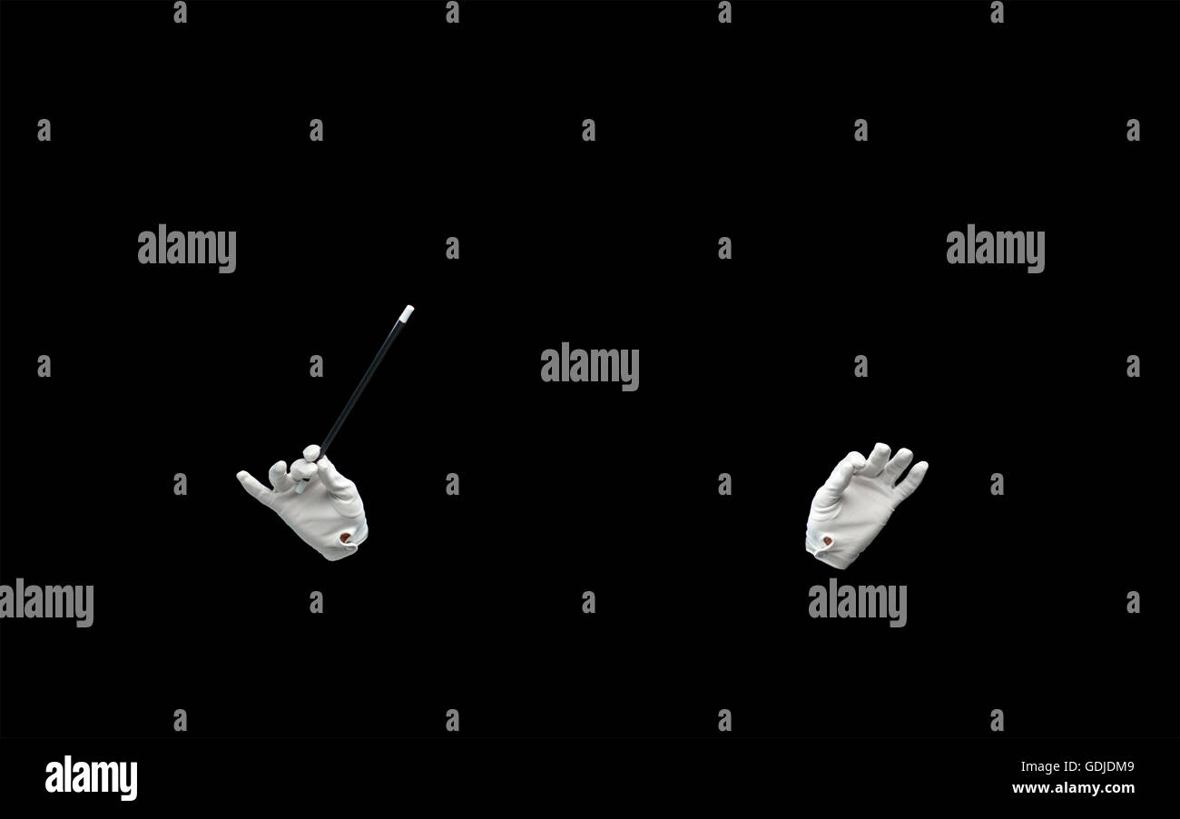 magician hands with magic wand showing trick Stock Photo - Alamy