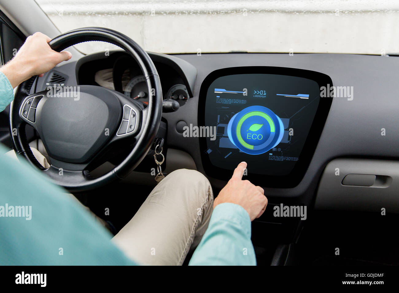 man driving car with eco mode on board computer Stock Photo - Alamy