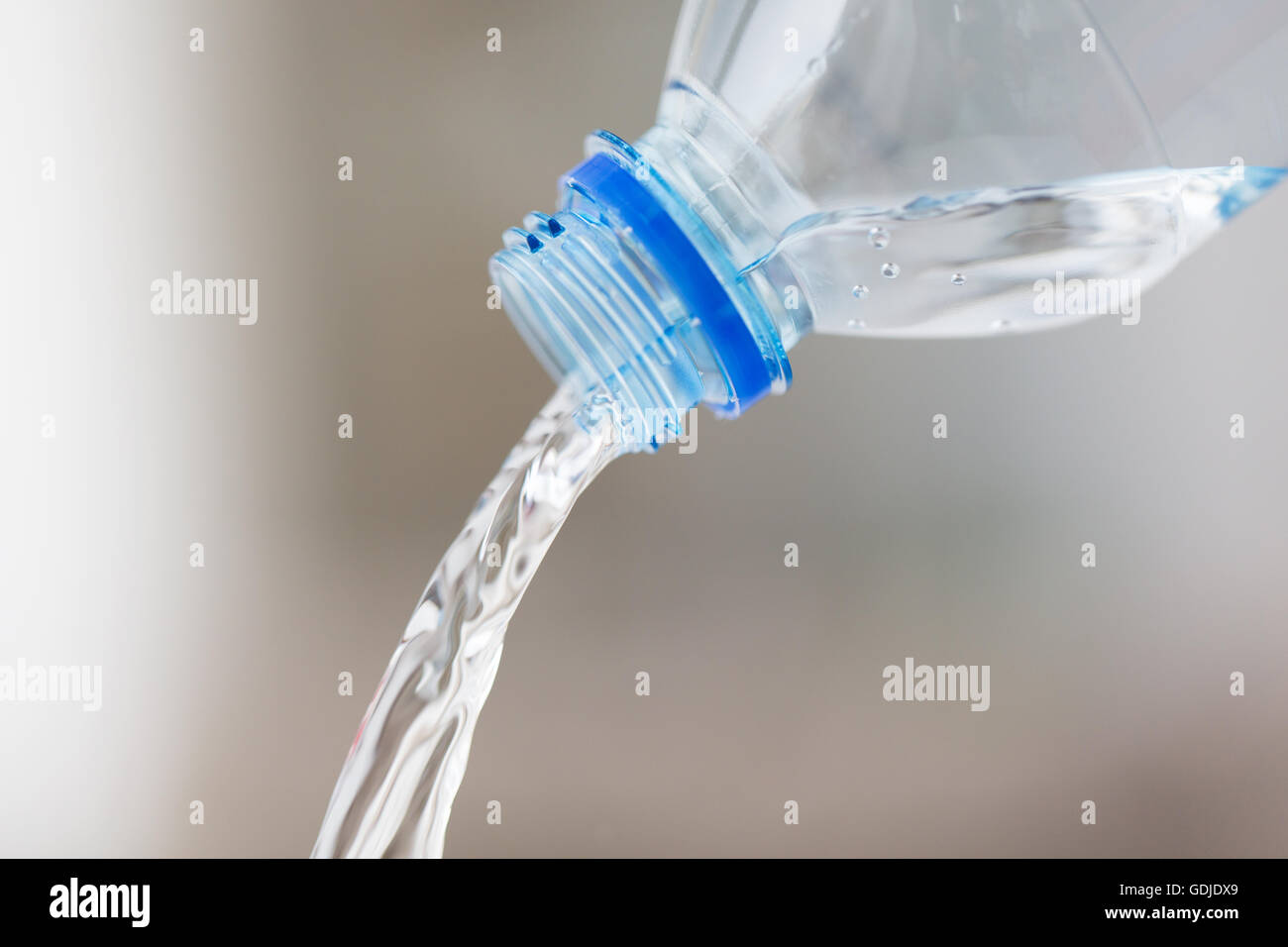 close up of water pouring from plastic bottle Stock Photo - Alamy