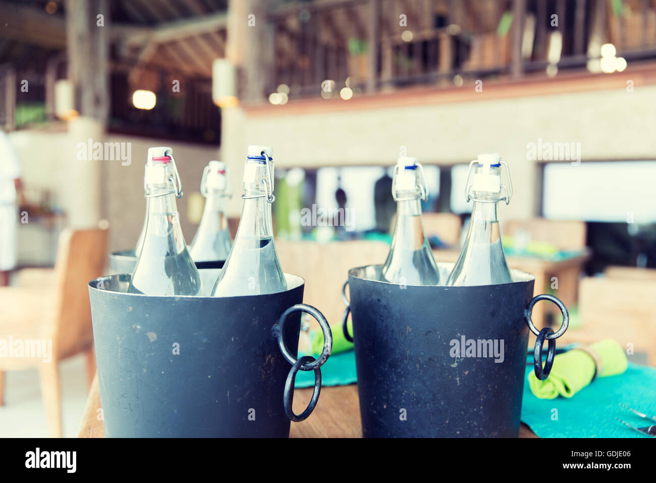 bottles of water in ice bucket at hotel restaurant Stock Photo - Alamy
