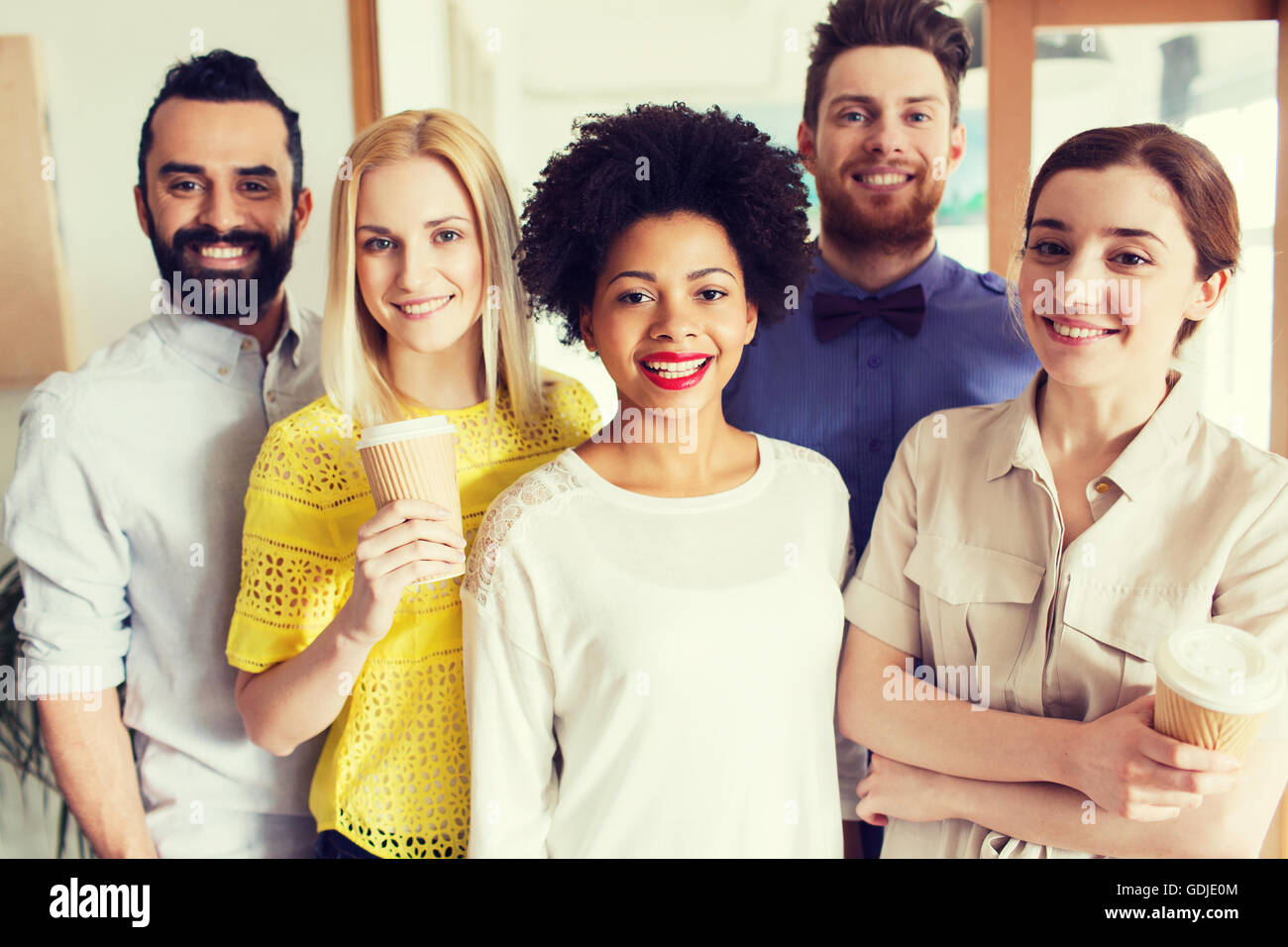 happy creative team in office Stock Photo - Alamy