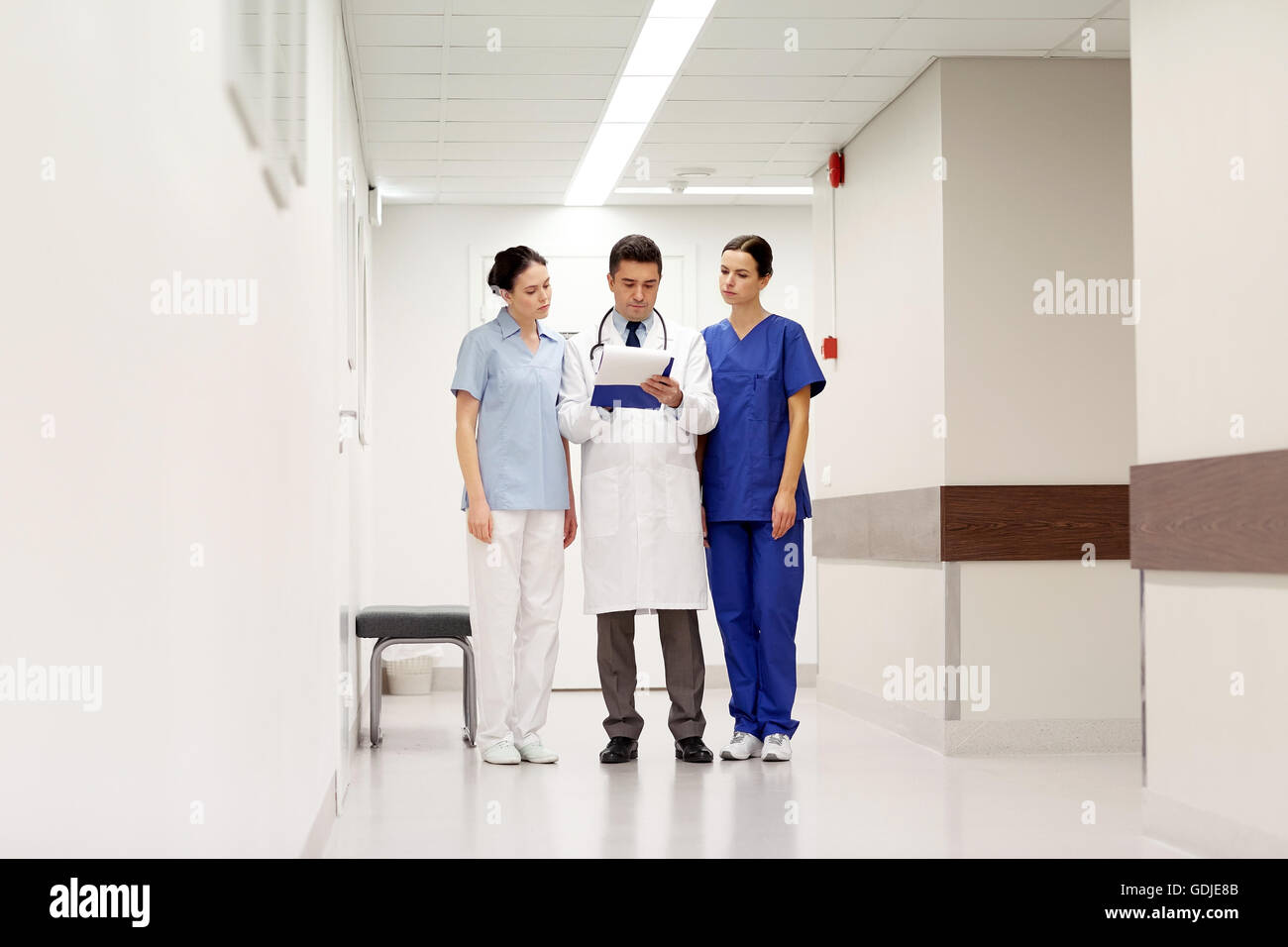 group of medics at hospital with clipboard Stock Photo - Alamy