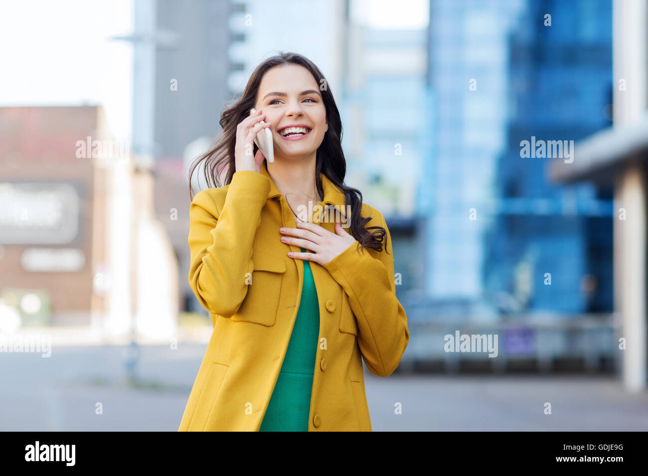 smiling young woman or girl calling on smartphone Stock Photo - Alamy
