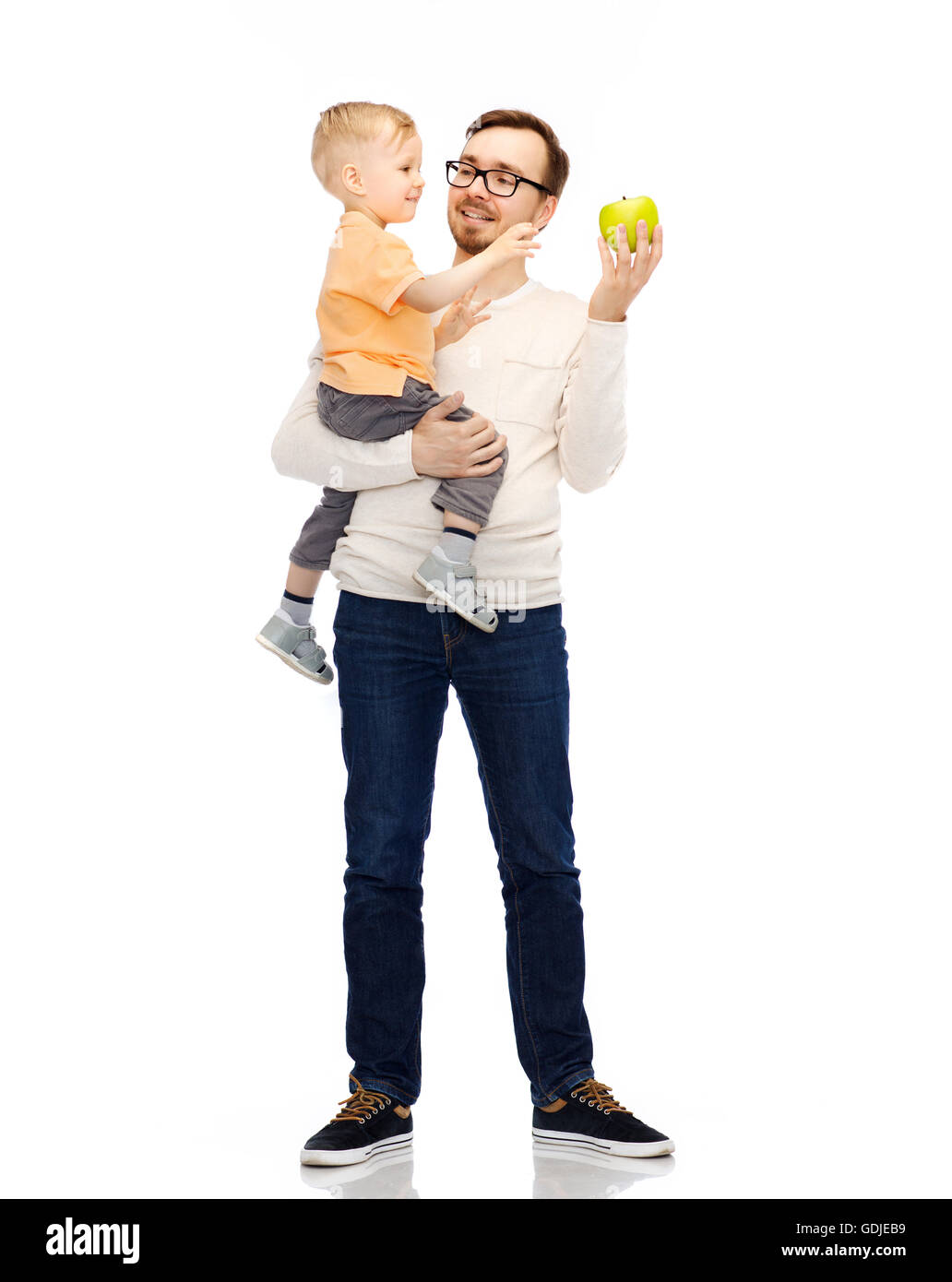 happy father and little son with green apple Stock Photo - Alamy
