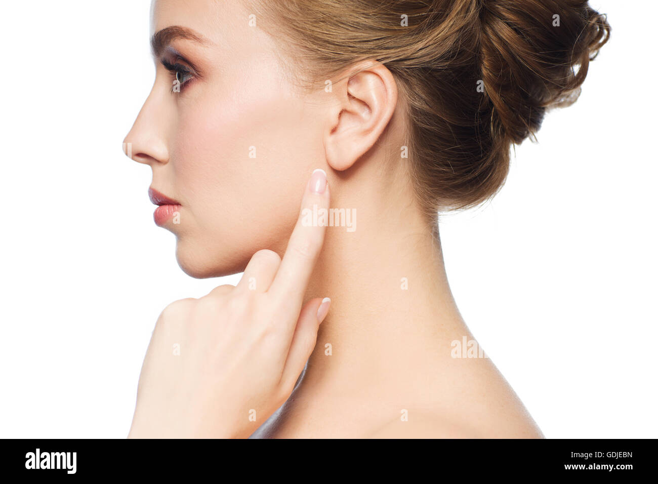 beautiful woman pointing finger to her ear Stock Photo - Alamy