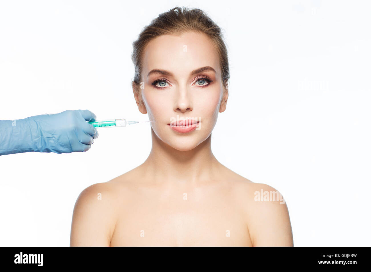 woman face and hand with syringe making injection Stock Photo - Alamy