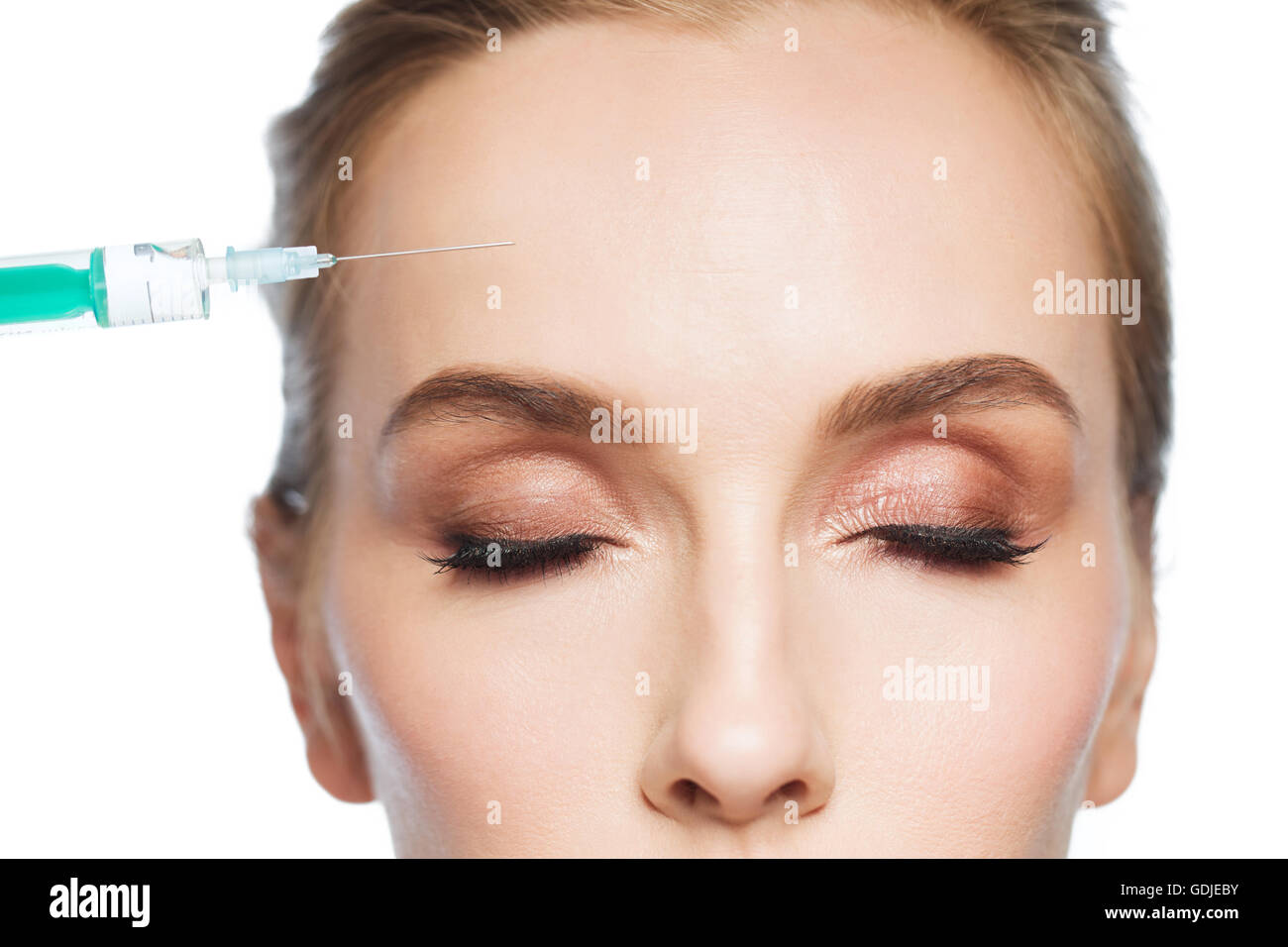 woman face and syringe making injection Stock Photo - Alamy