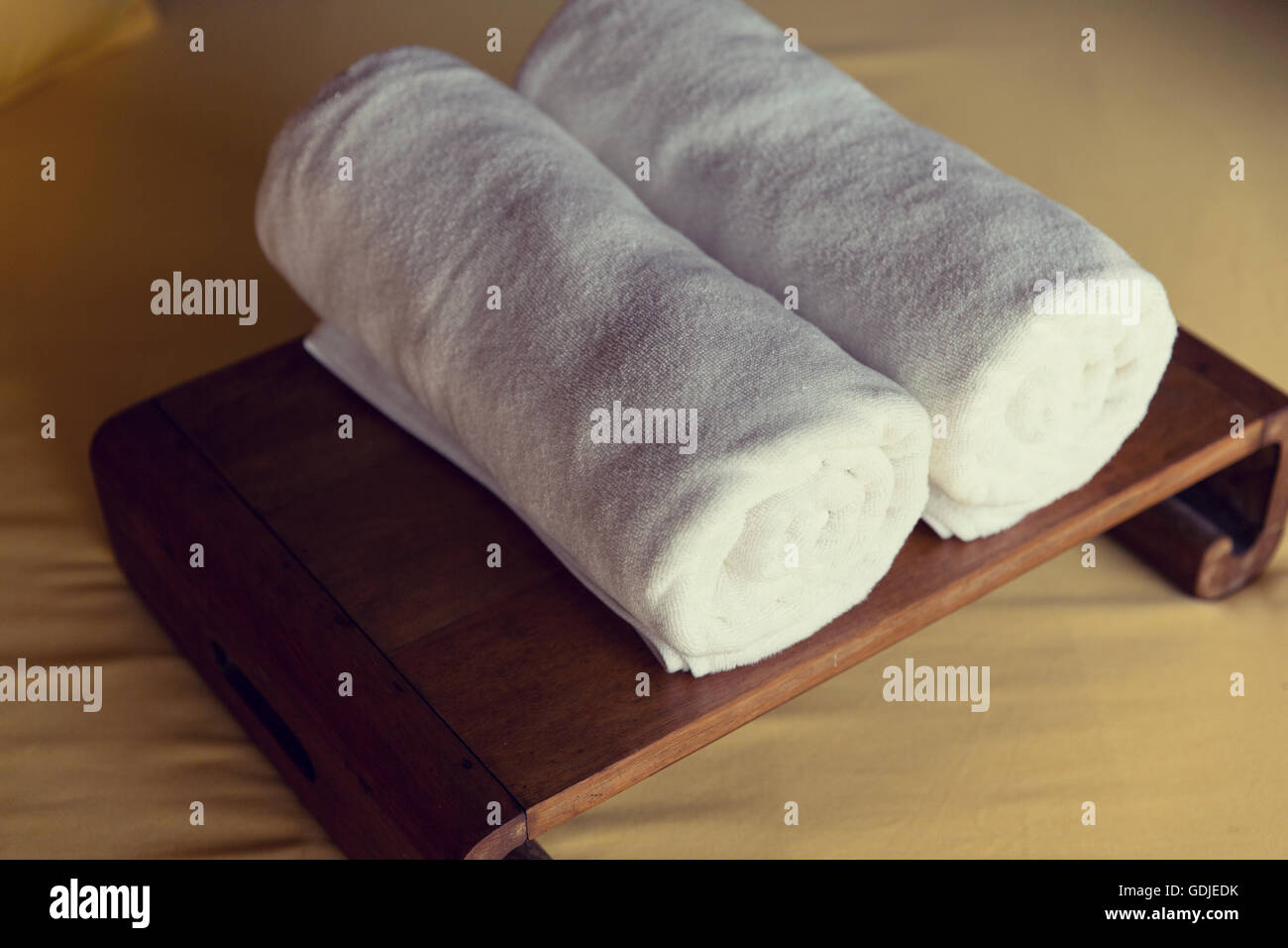 rolled bath towels at hotel spa Stock Photo - Alamy