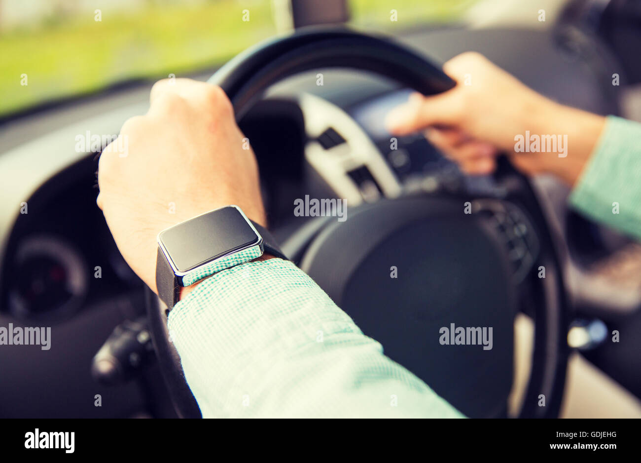 close up of man with wristwatch driving car Stock Photo - Alamy