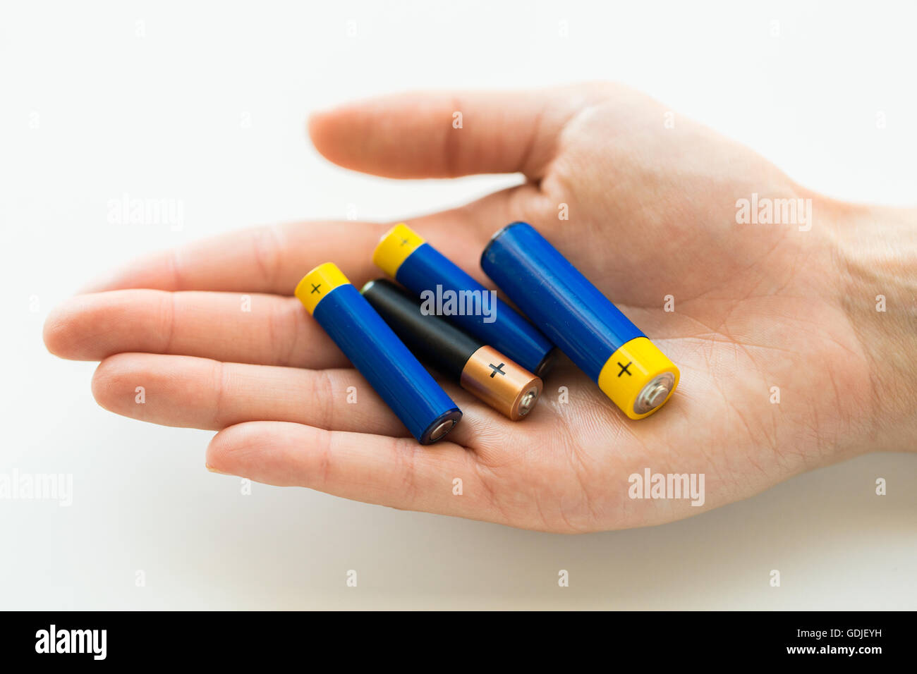 Hand holding aa batteries hi-res stock photography and images - Alamy