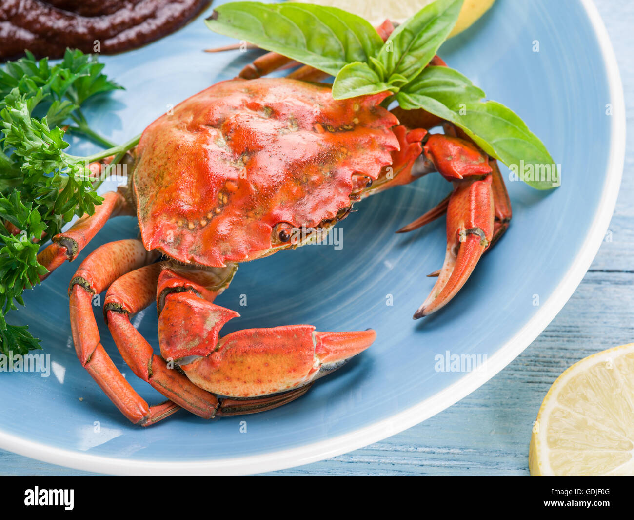 Seafood dish - cooked crab with lemon and herbs Stock Photo - Alamy