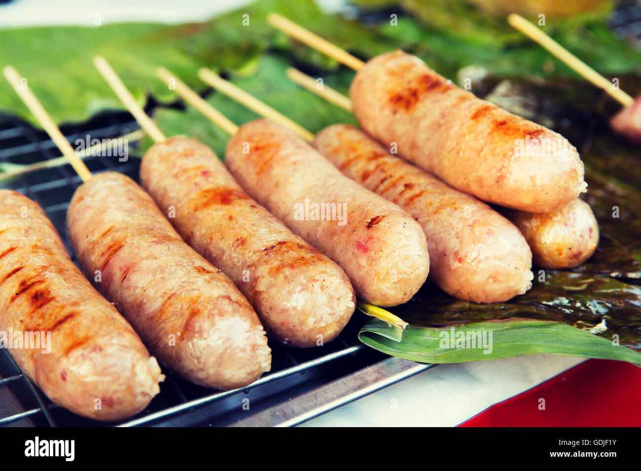 Preparing grilled sausages on barbeque hi-res stock photography and ...