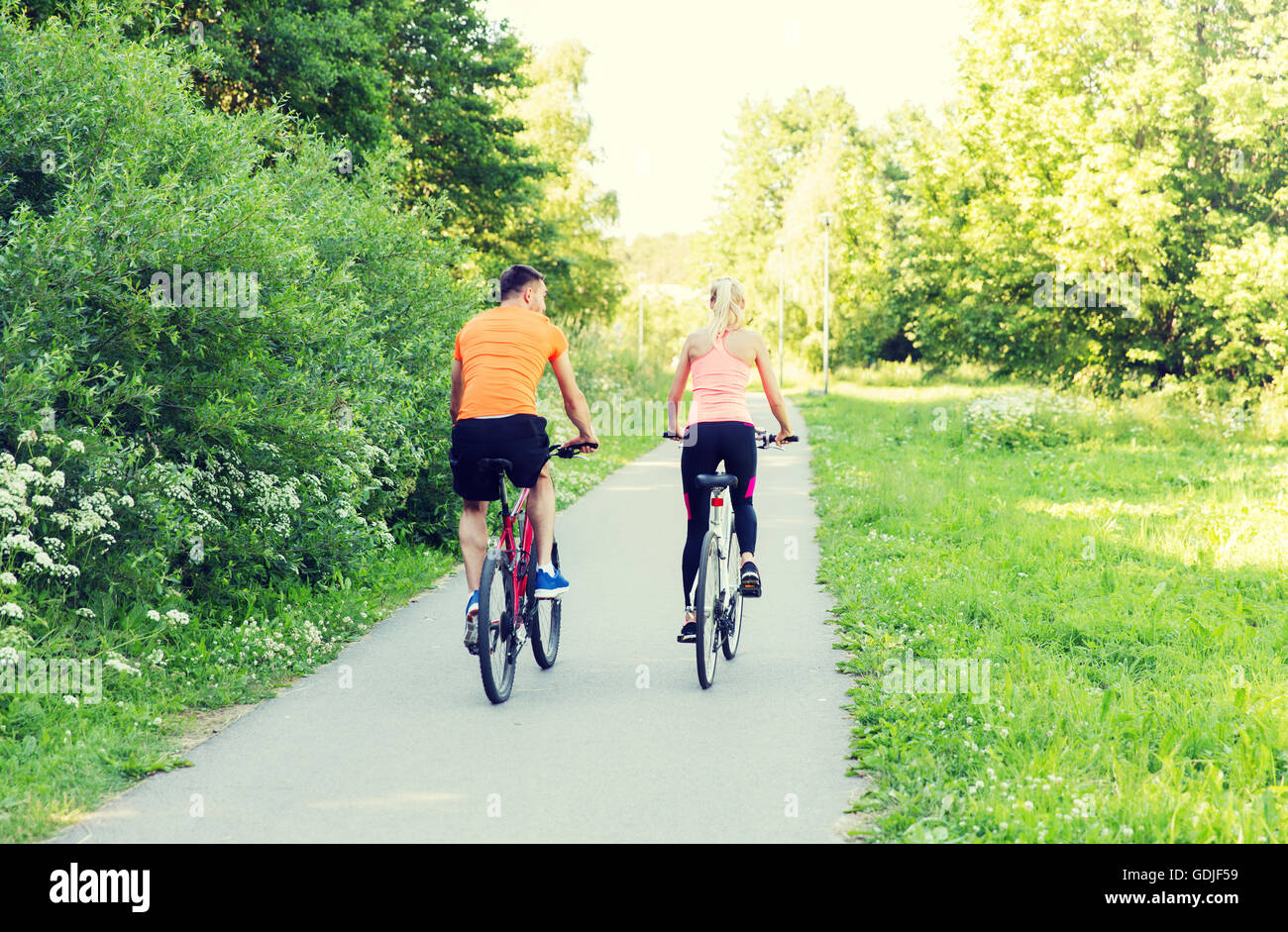 Back view girl riding bicycle hi-res stock photography and images - Alamy