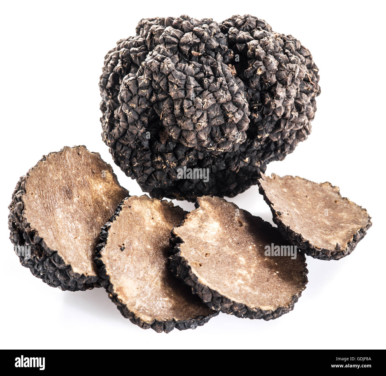 Black truffles isolated on a white background Stock Photo - Alamy