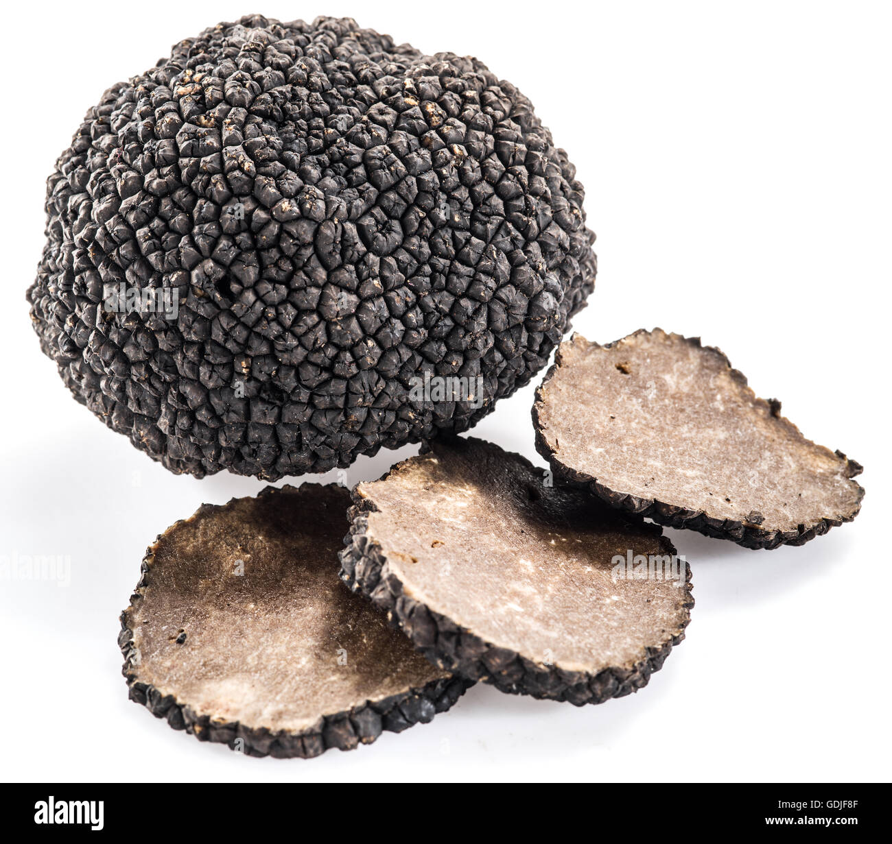 Black truffles isolated on a white background Stock Photo - Alamy