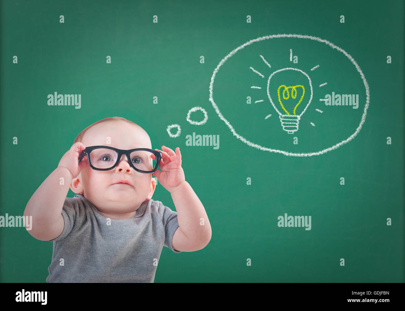 baby with glasses has an idea Stock Photo - Alamy