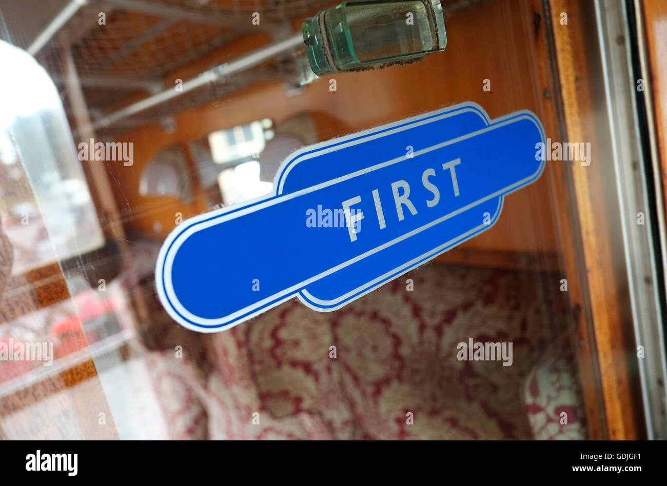 first class window sticker in old railway carriage Stock Photo - Alamy