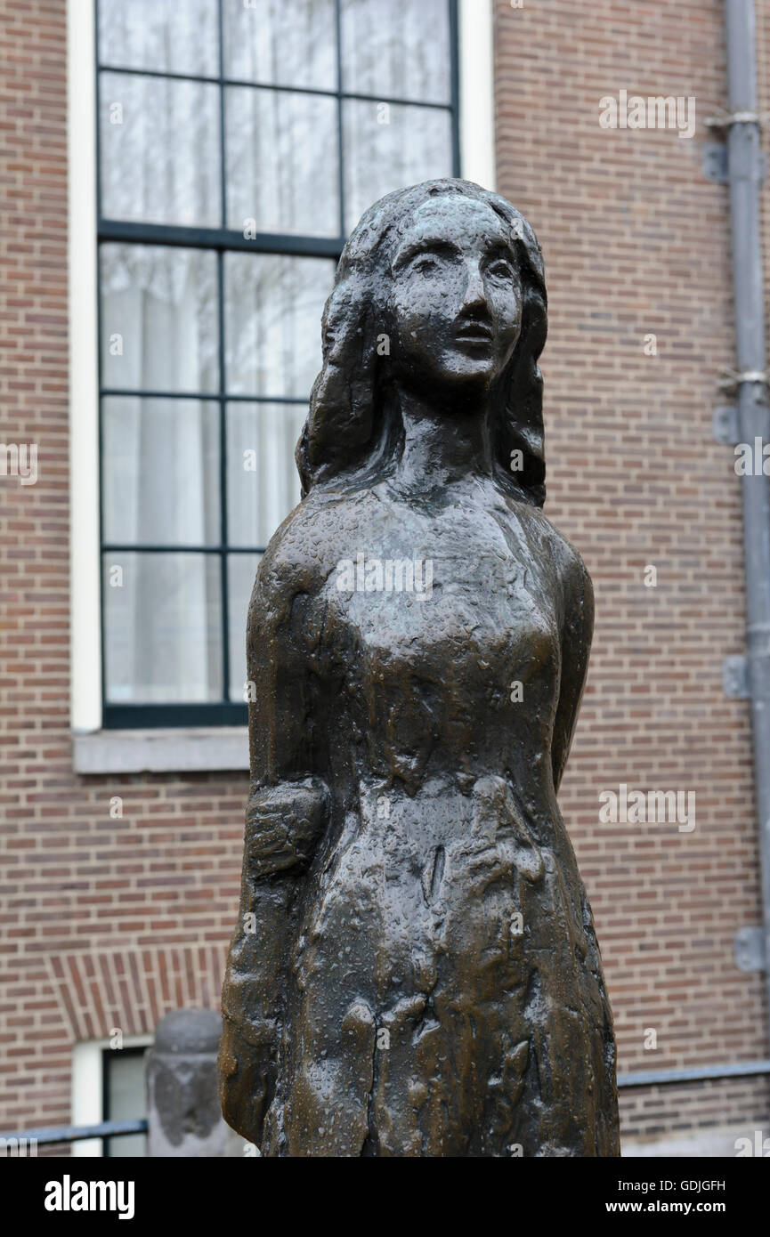 A small bronze sculpture of 'Anne Frank' as a standing small girl ...