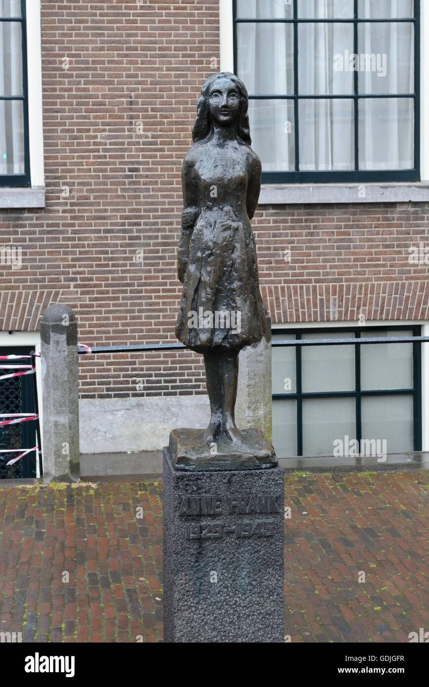A small bronze sculpture of 'Anne Frank' as a standing small girl ...