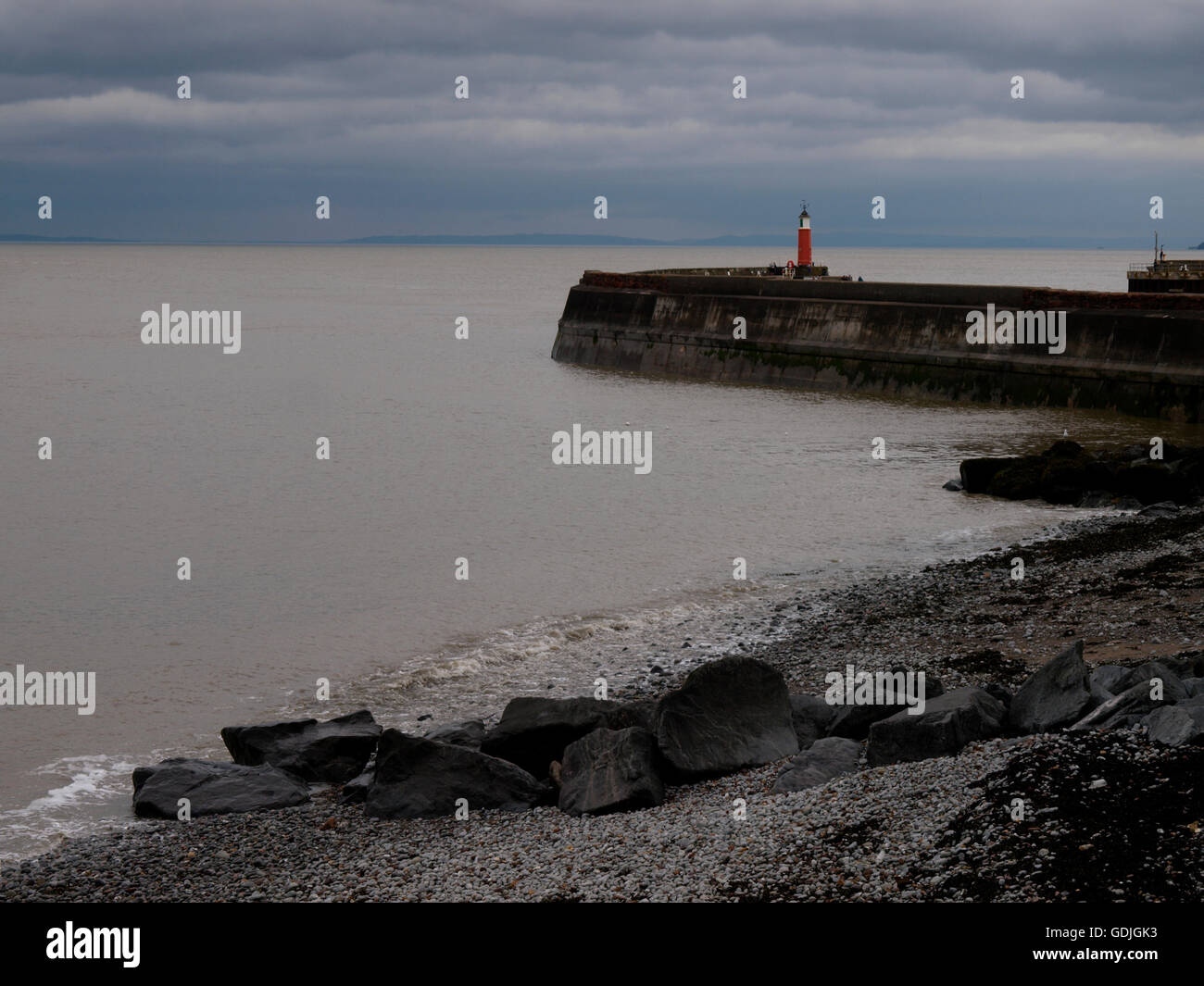 Beach, Harbour wall and lighthouse, Watchet, Somerset, UK Stock Photo ...