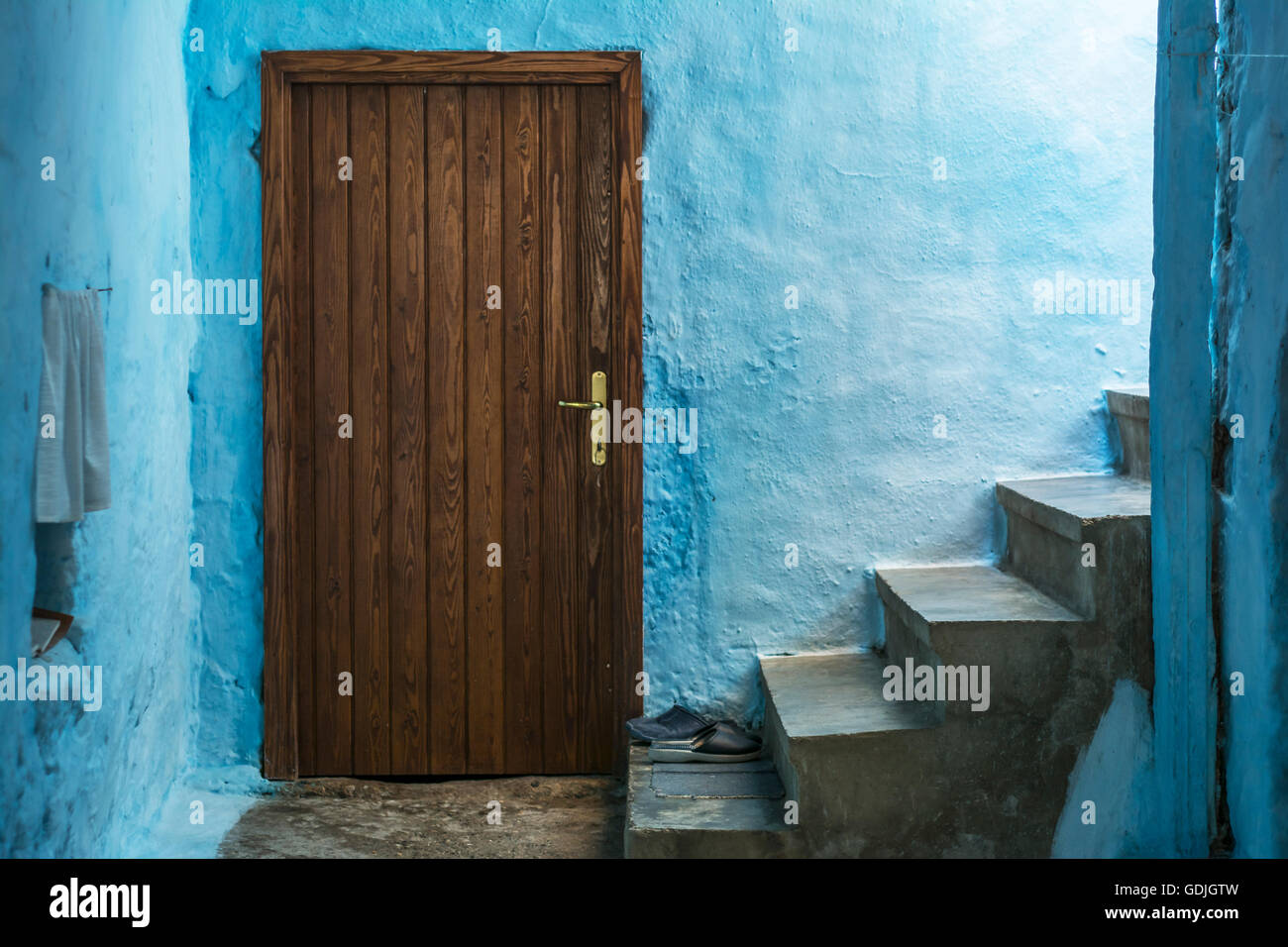 Blue whitewashed wall stairs and old door Stock Photo - Alamy