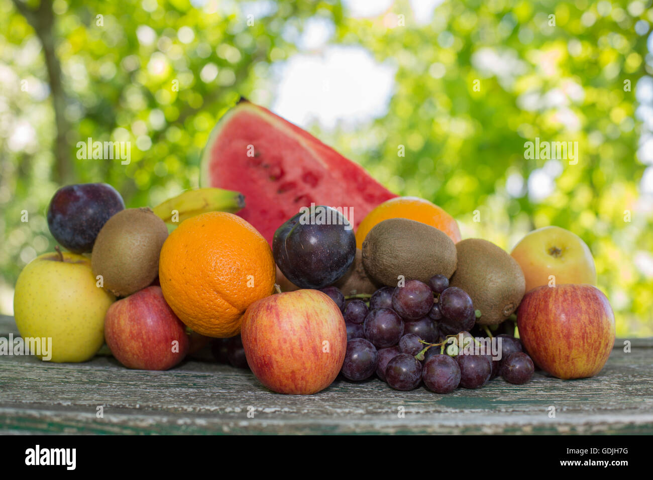 fruits in wooden table, outdoor Stock Photo - Alamy