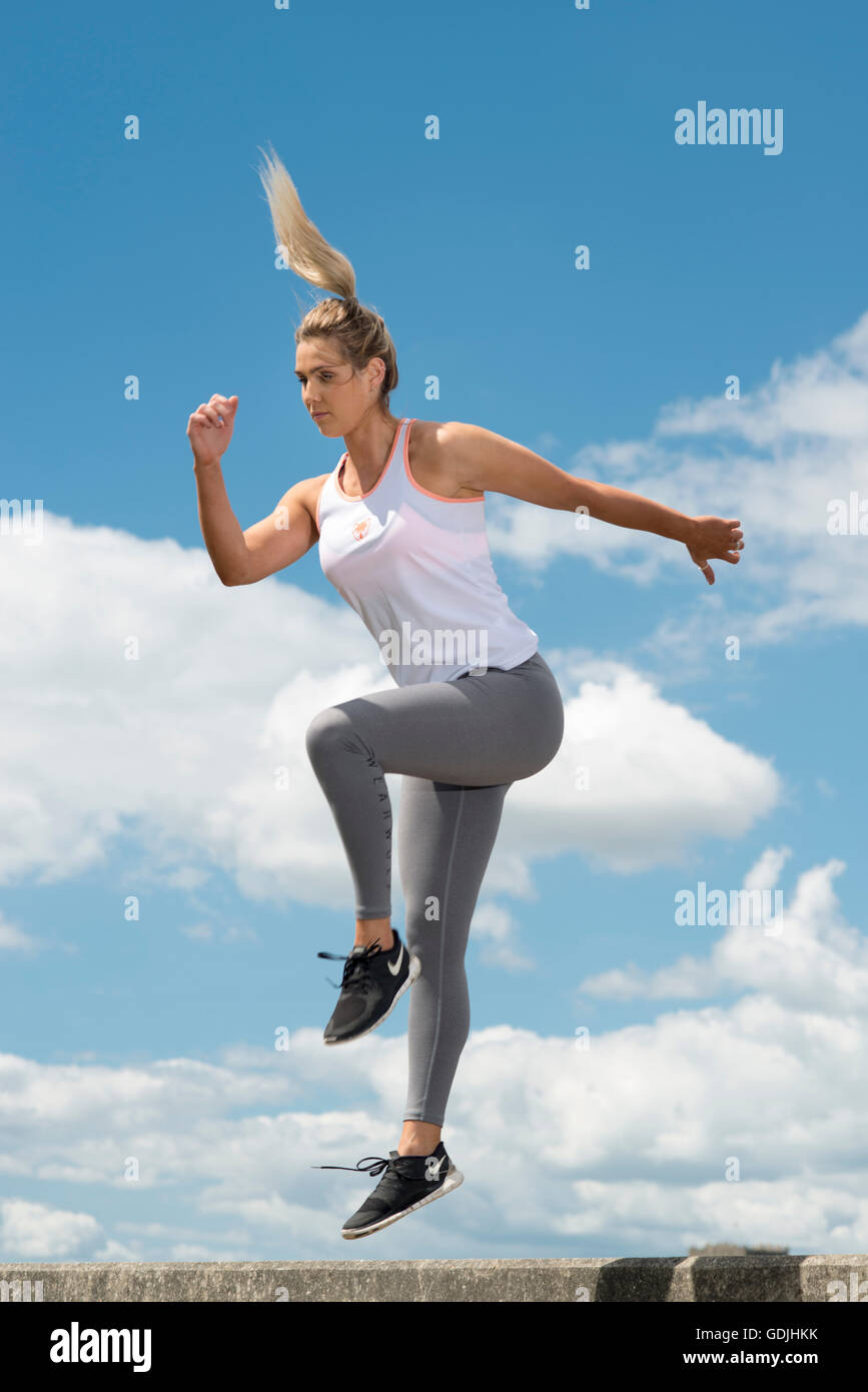 fit woman running and jumping Stock Photo - Alamy