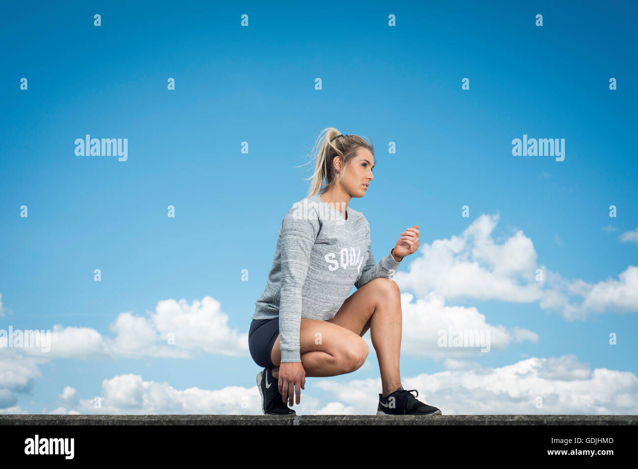 Crouching down hi-res stock photography and images - Alamy