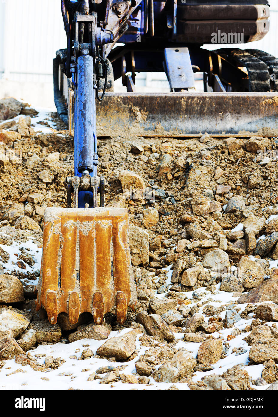 Small bulldozer excavator loader machine works outdoors at construction ...