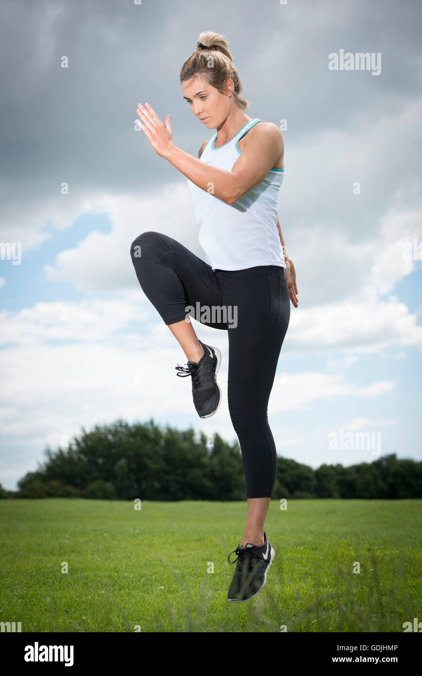 fit woman running and jumping, keeping fit Stock Photo - Alamy