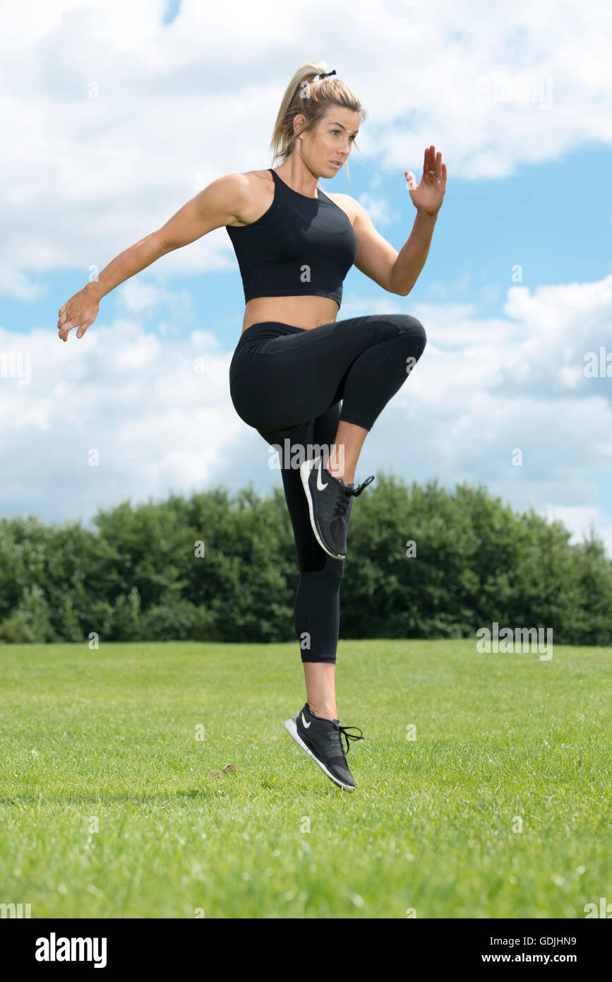 fit woman running and jumping, keeping fit Stock Photo - Alamy