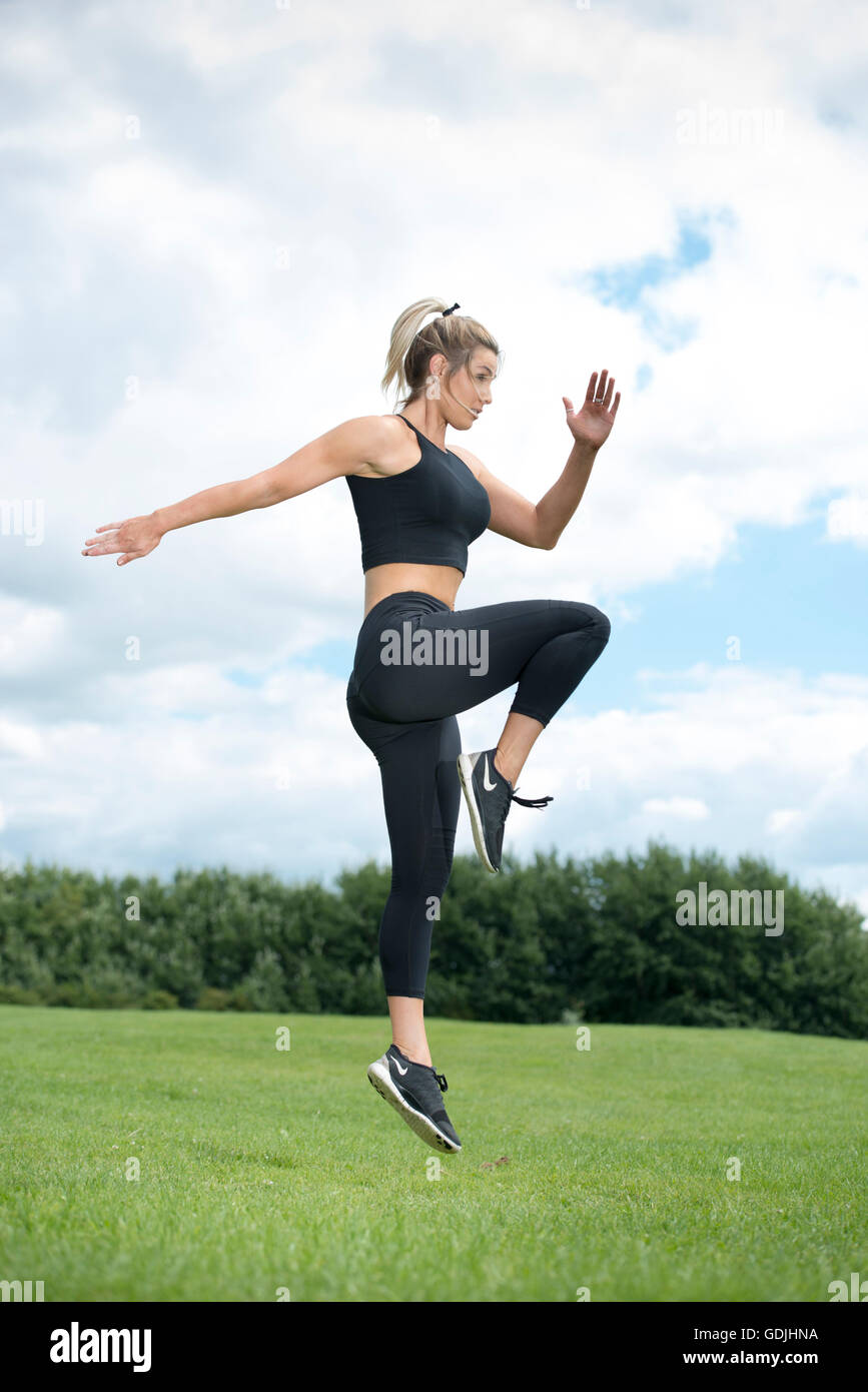 fit woman running and jumping, keeping fit Stock Photo - Alamy