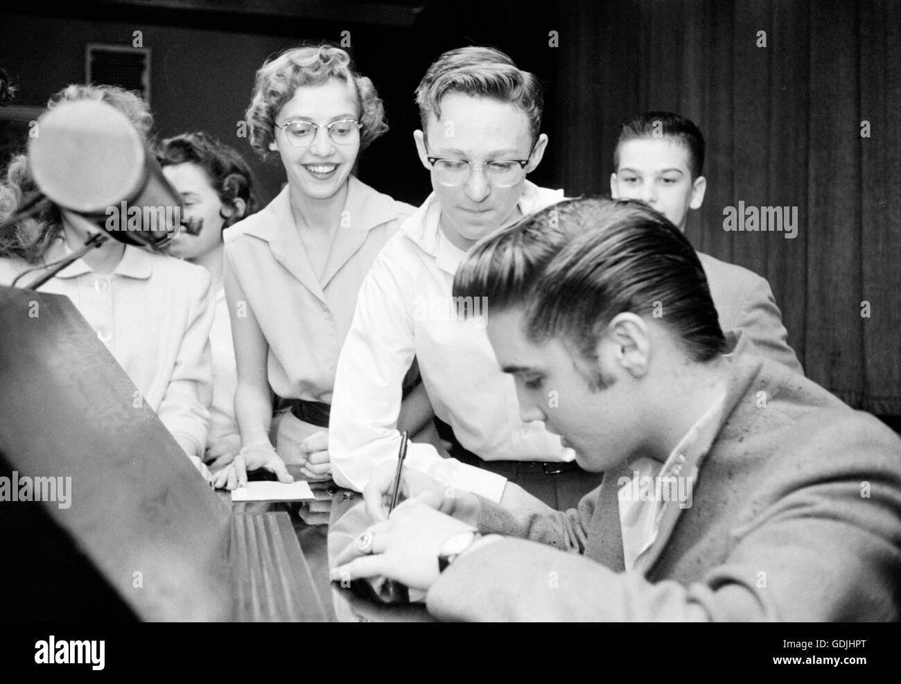 Elvis Presley meets with fans and signs autographs at the Fox Theater ...