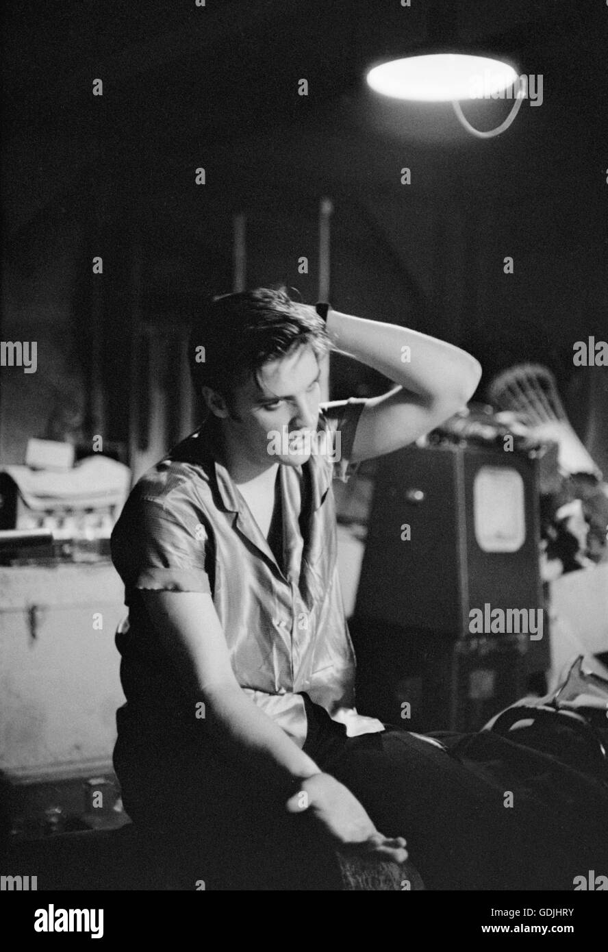 Elvis Presley, between performances, backstage at the University of ...