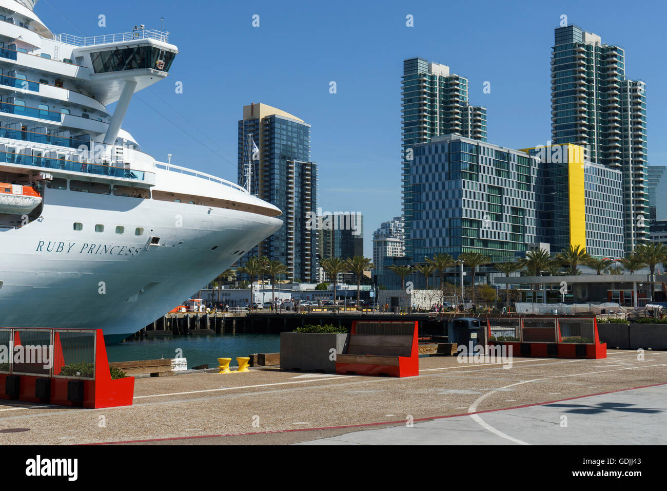 Bow of the Ruby Princess cruise ship pointing to the hi-rise buildings ...