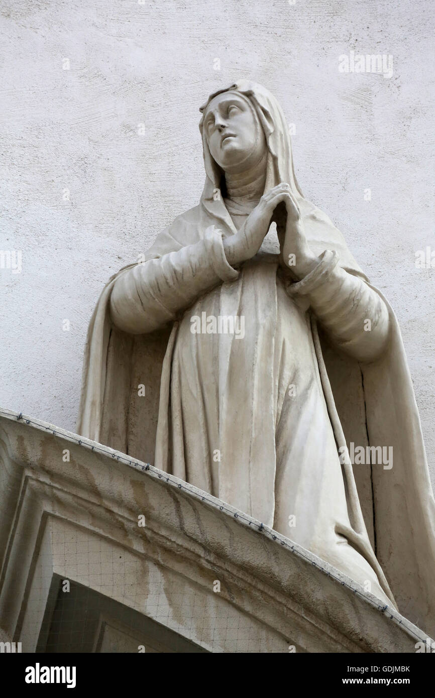 Agnes of Montepulciano on the facade of Dominican Church in Vienna ...