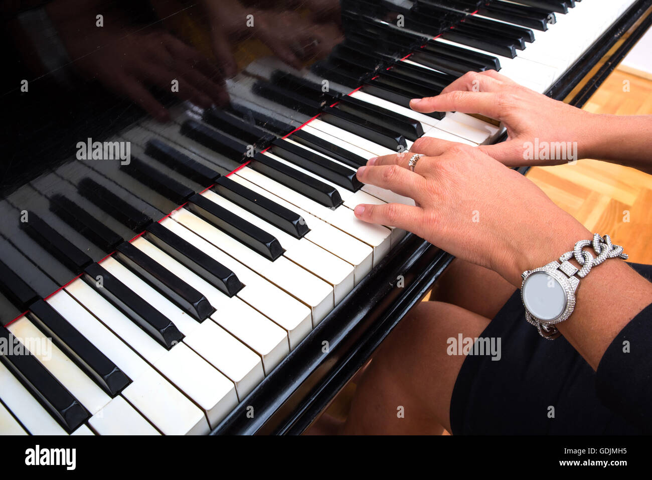 Hands of an elegant classical musician woman playing on piano Stock ...