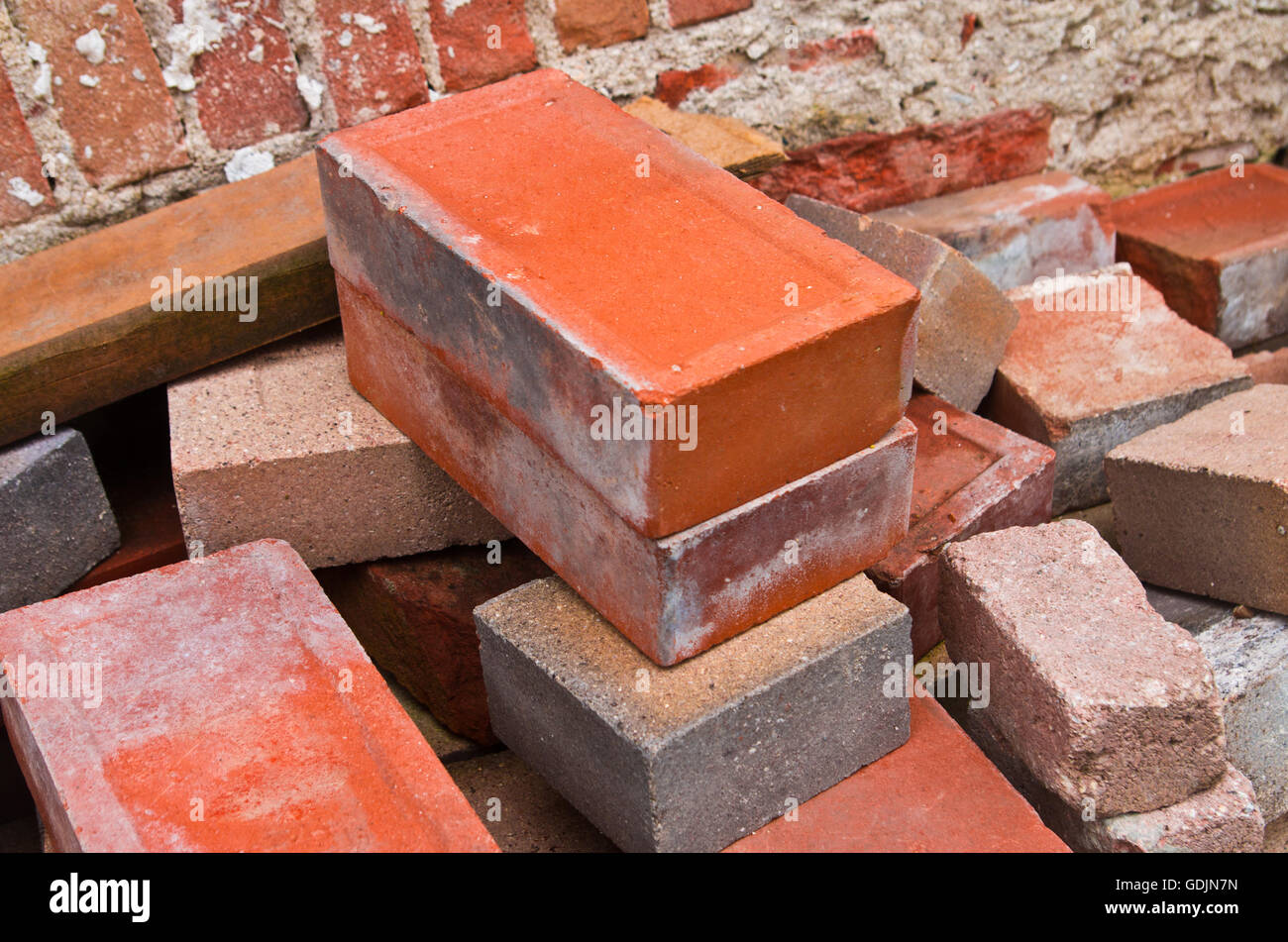 clay bricks of different color and type ready to be used to build walls ...