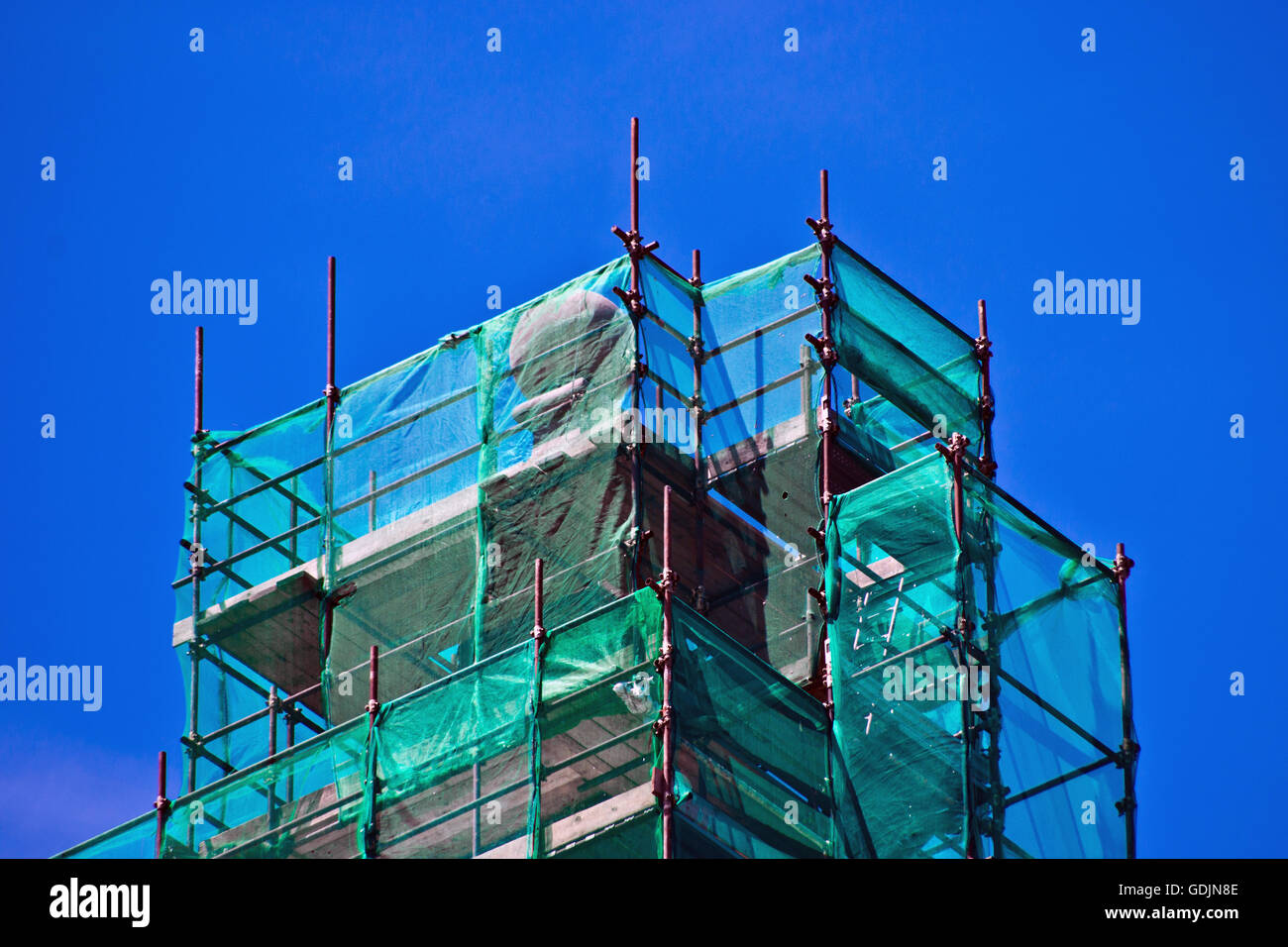 scaffolding of iron pipes and green network used for the restoration of ...